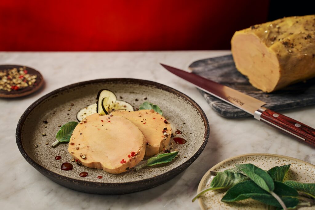 Duck foie gras ballotine with veins removed, pepper and black radishes ...